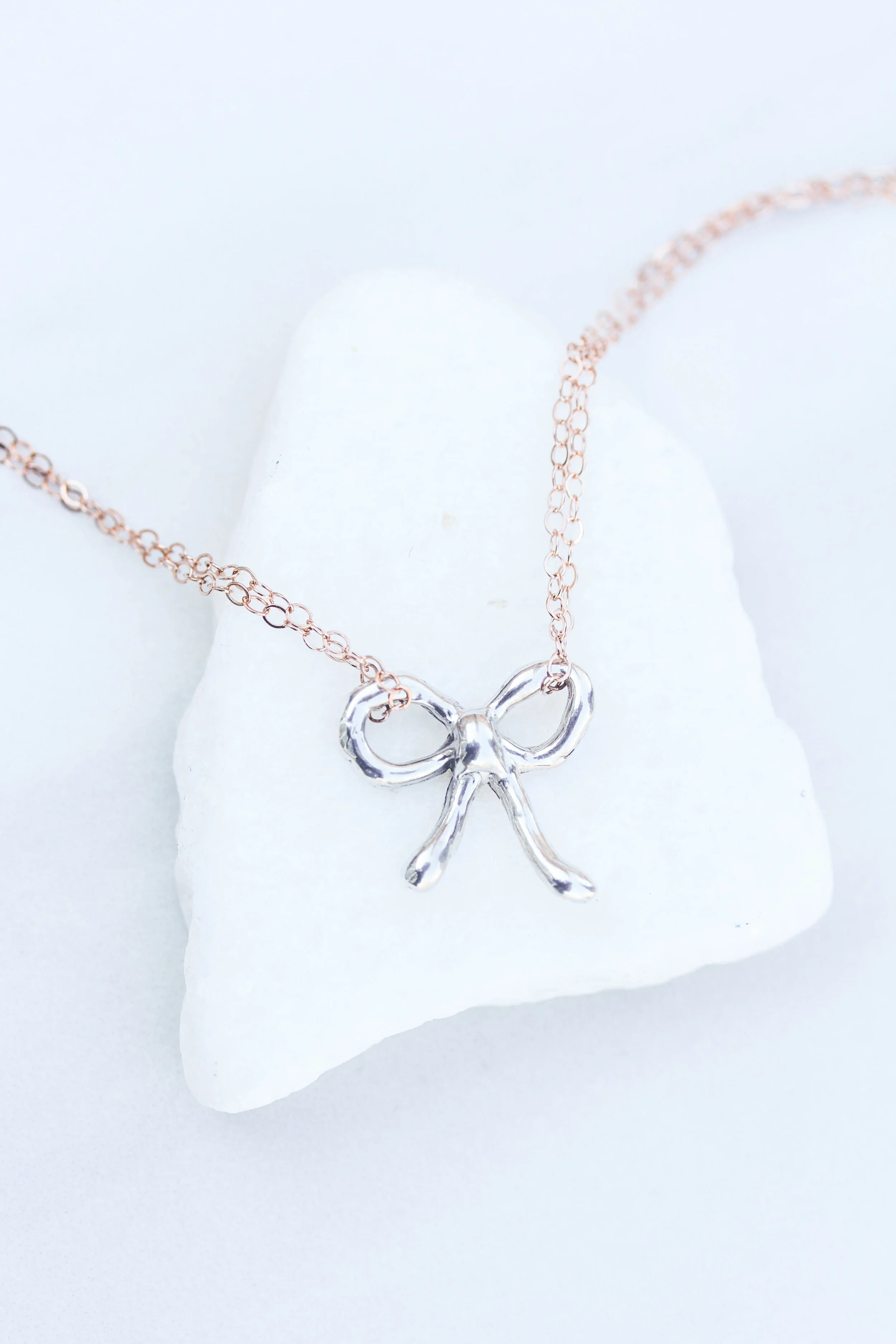 Rose gold bow necklace store